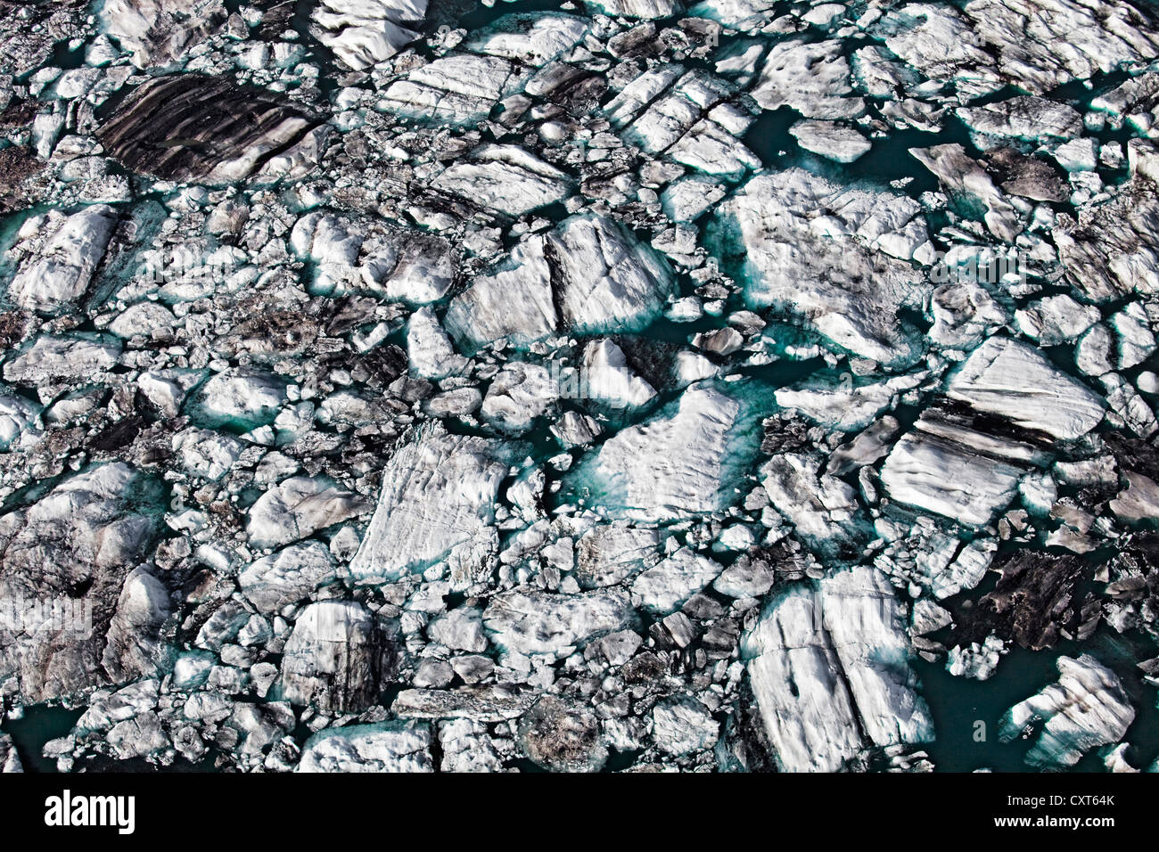 Aerial view, icebergs and ice floes with lines and structures formed by ...