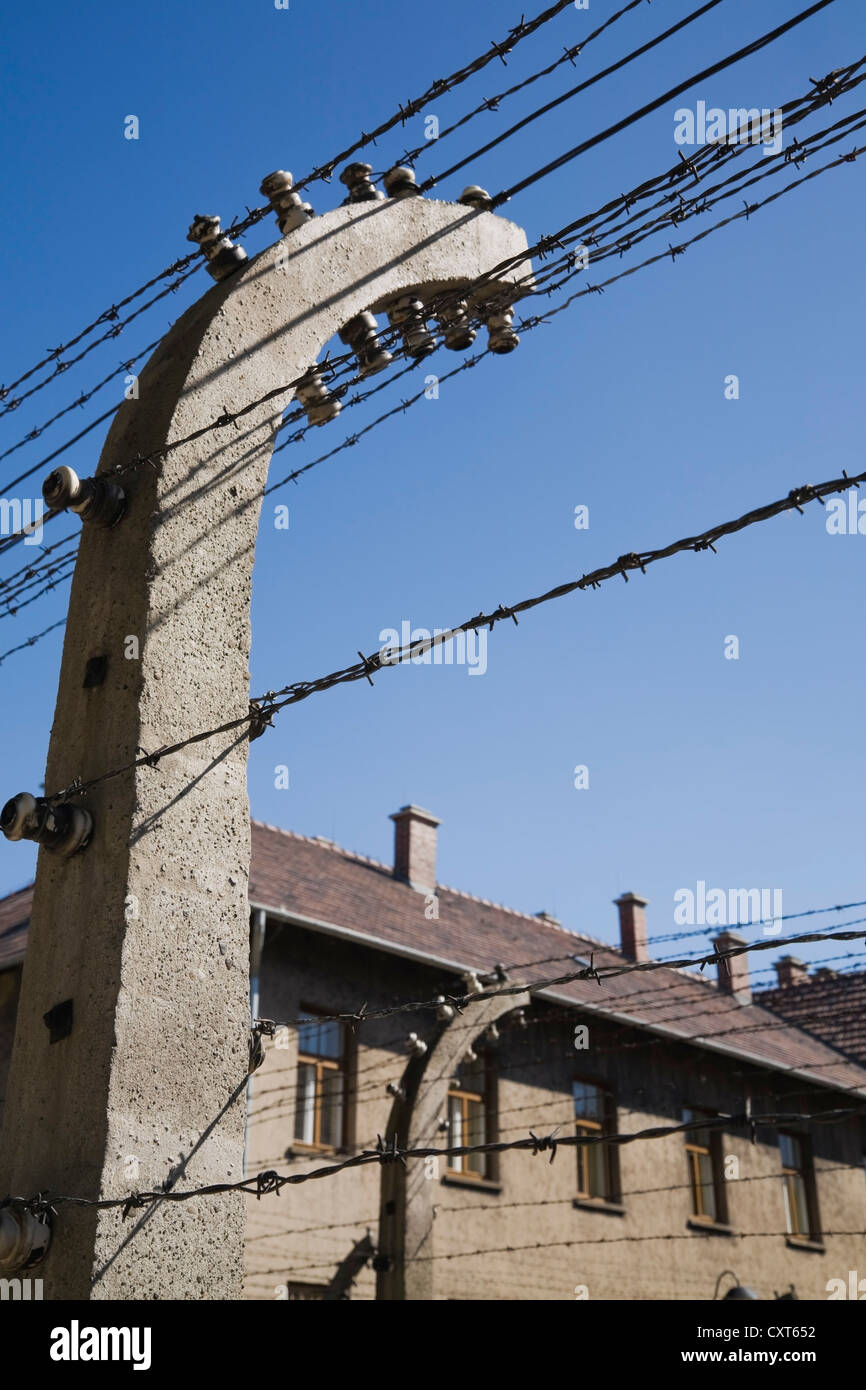 Barb wire electric fence and building inside the Auschwitz I former ... Barb wire electric fence and building inside the Auschwitz I former ...