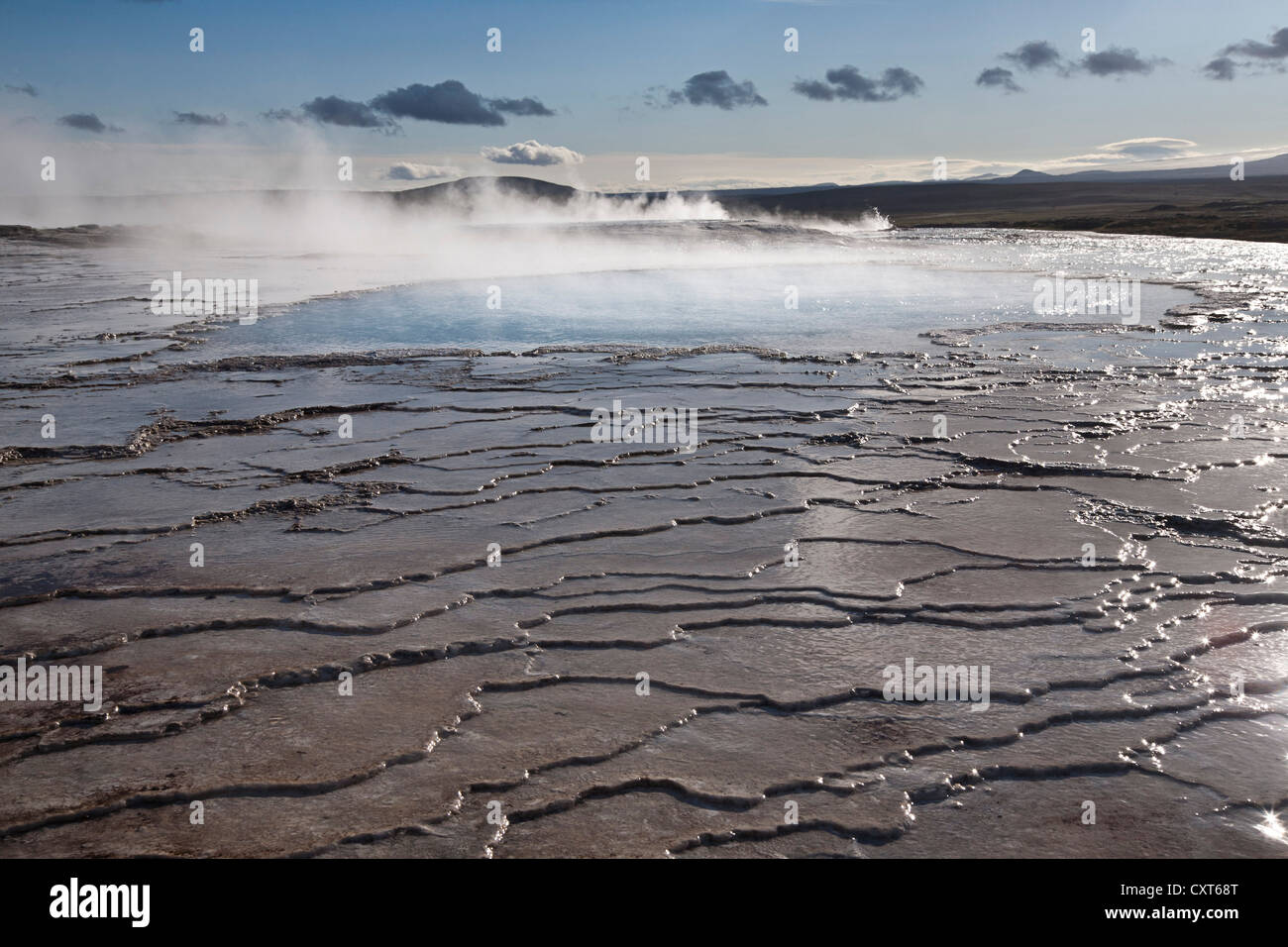 Limestone sinter terraces with the hot water pools of Meyrarauga, Girl ...