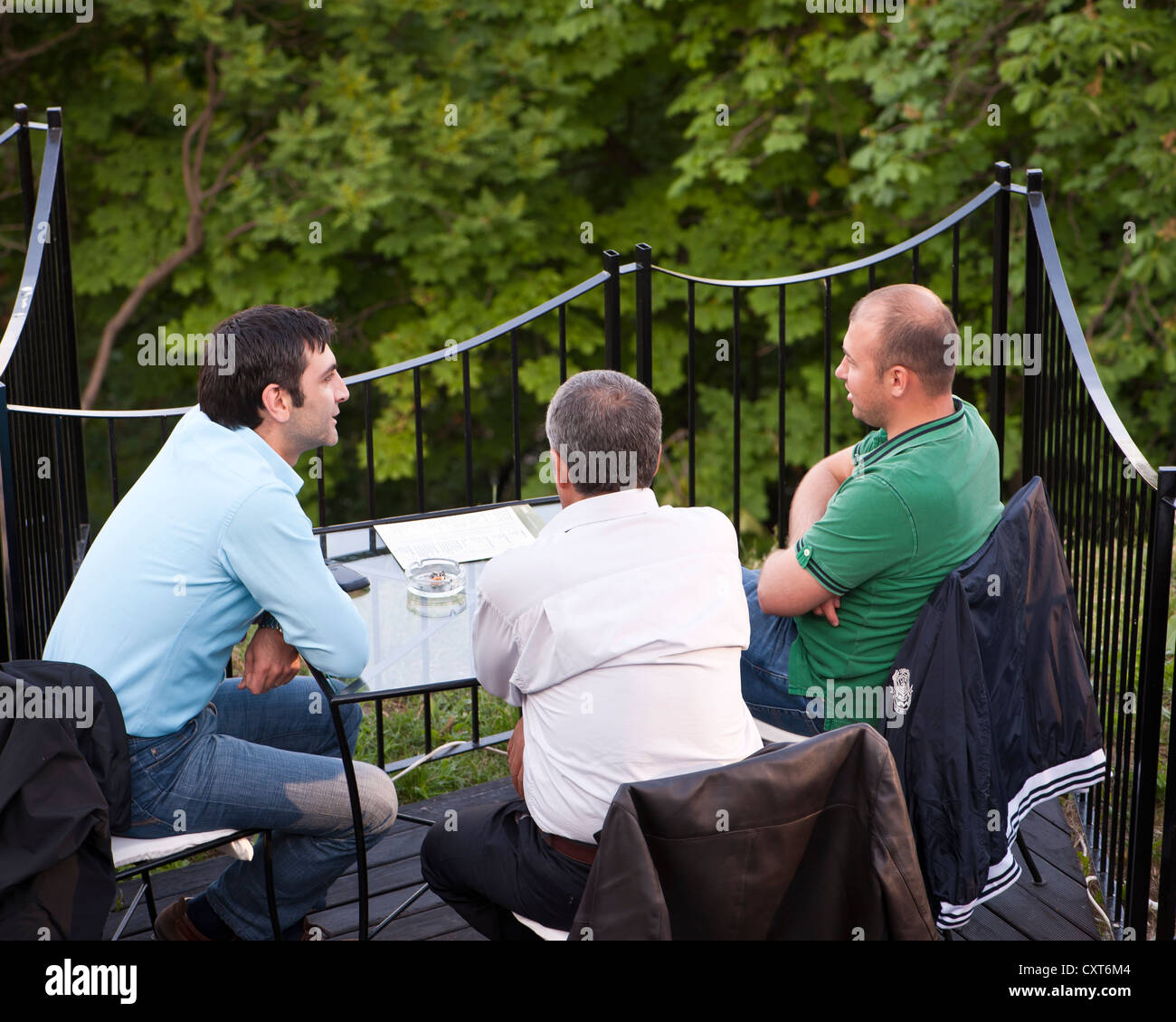 Three men enjoy lunch in Budapest Stock Photo - Alamy