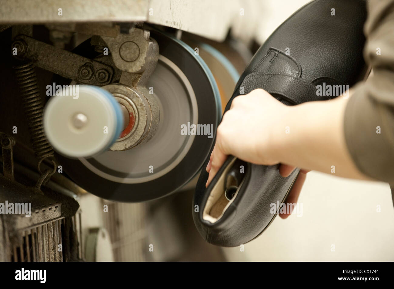 Orthopedic shoemaker grinding the soles of a shoe Stock Photo - Alamy