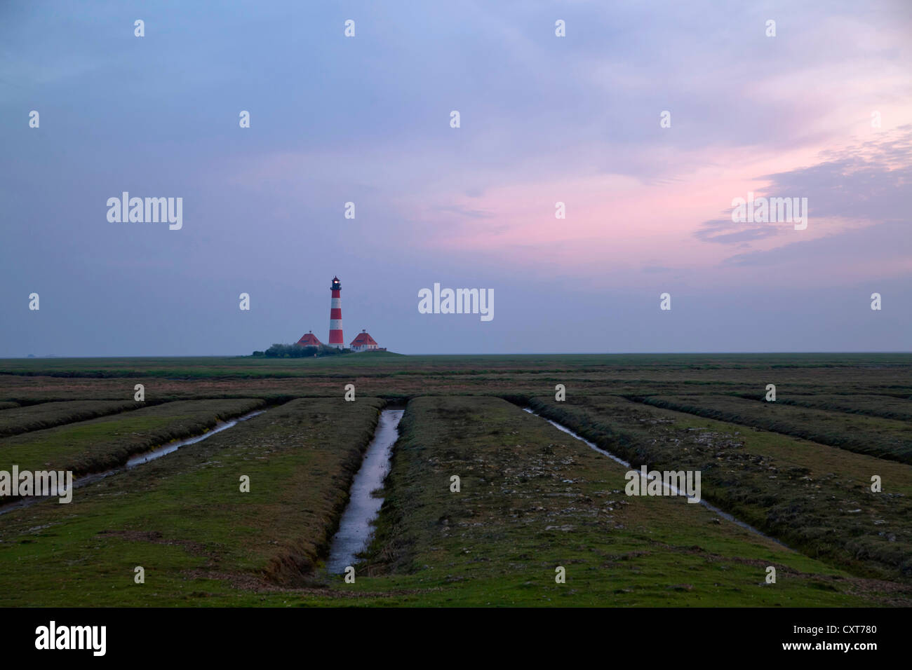 Westerheversand lighthouse and salt meadows at dusk, Westerhever ...
