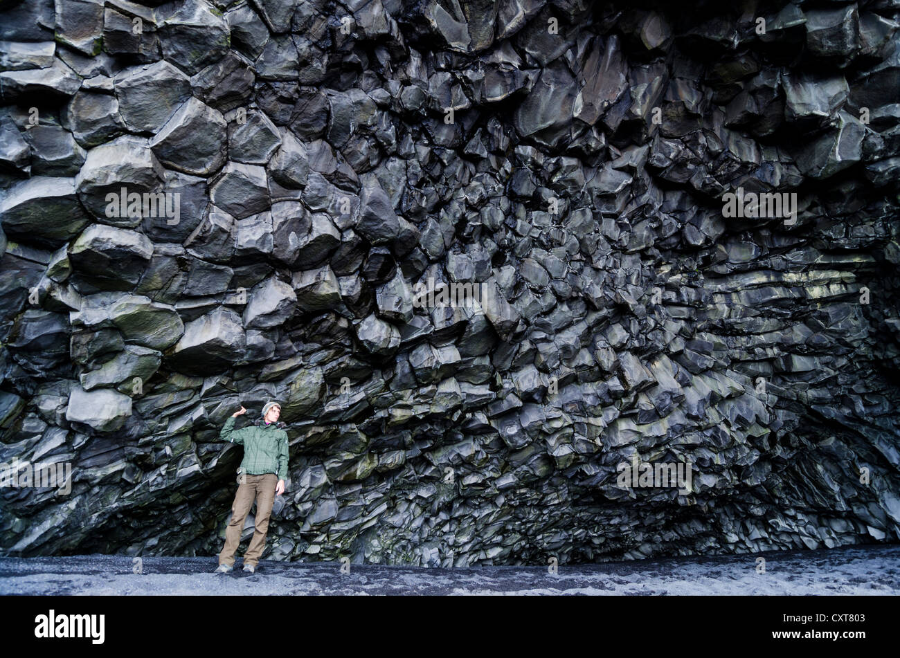 Woman in Hálsanefshellir cave with basalt formations, Reynisfjara beach ...