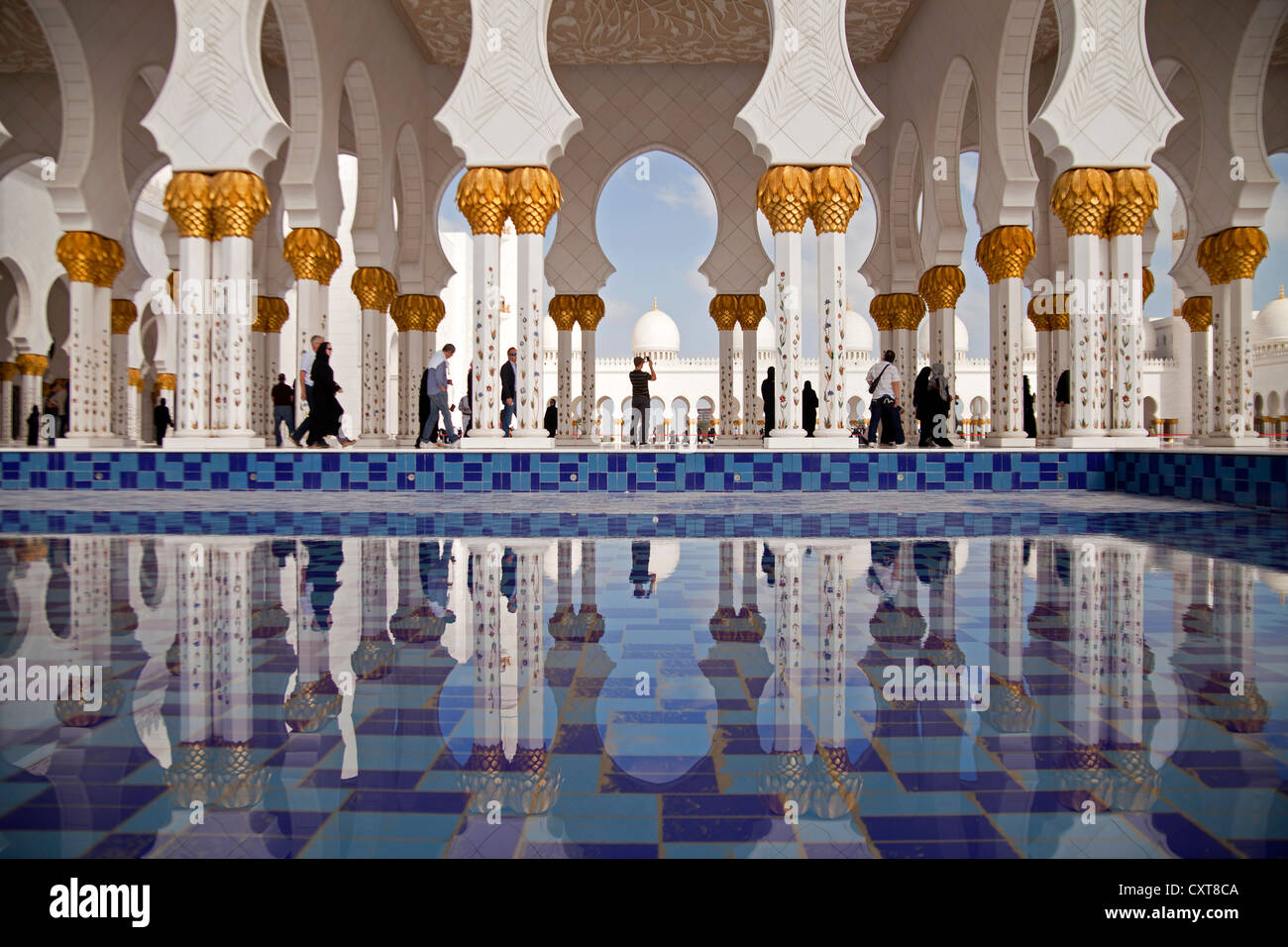 Colonnades reflected in a pool of the Sheikh Zayed Mosque in Abu Dhabi ...