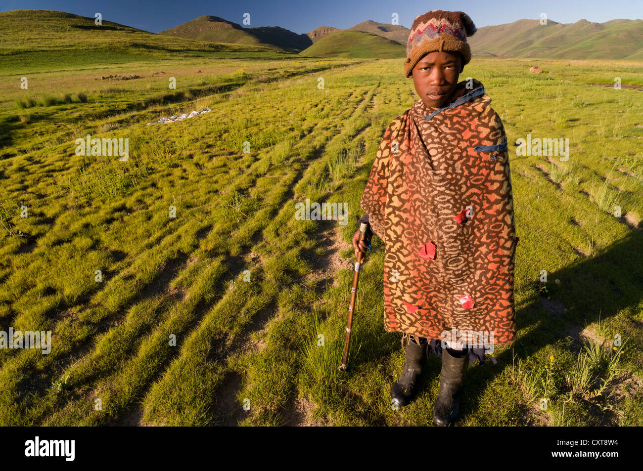 Young Basotho man wearing a traditional costume, shepherd, Drakensberg ...