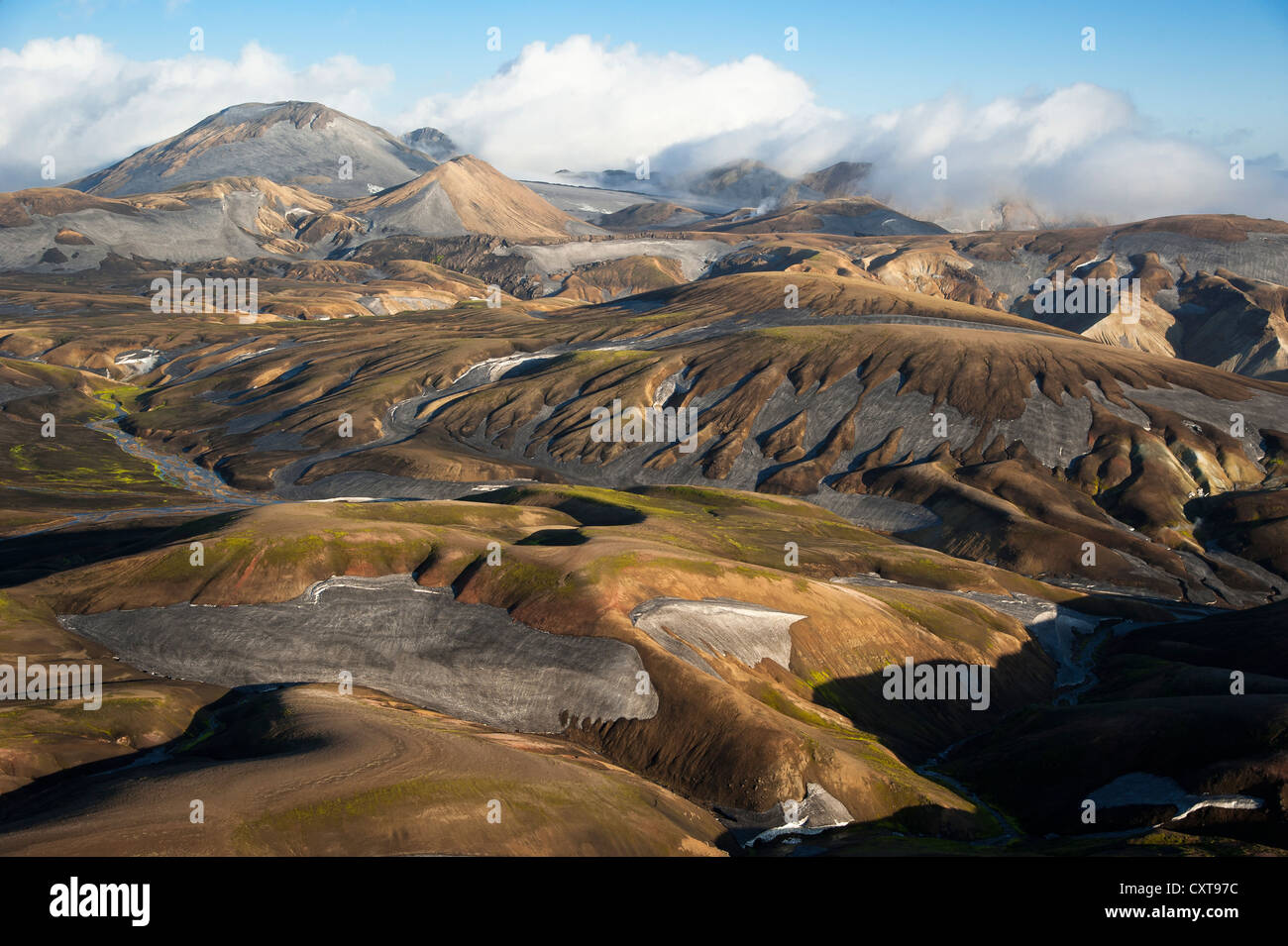 Aerial view, rhyolite mountains covered in snow and ashes ...