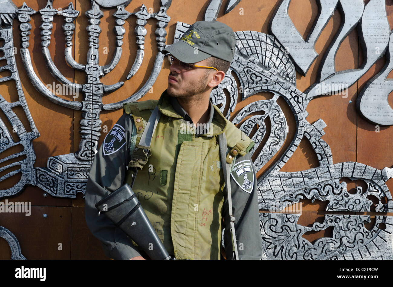 Sukkot Fetival Israeli soldier in front of a Sukkah booth at the ...