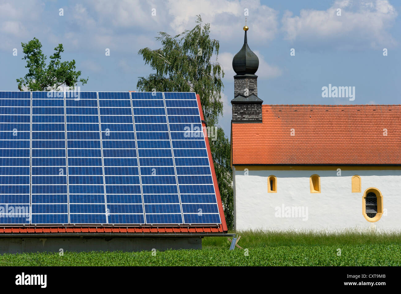 Photovoltaic system, solar power station on the roof of a farm building ...