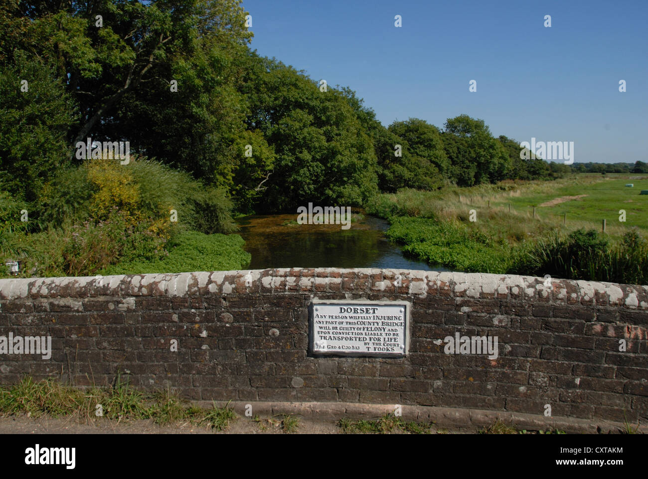 A stone bridge over the River Frome at Bockhampton Dorset UK Stock ...