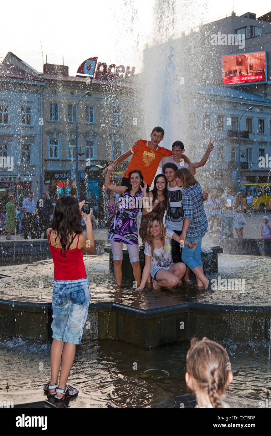 People playing in the fountain, L'viv old town, Ukraine Stock Photo - Alamy