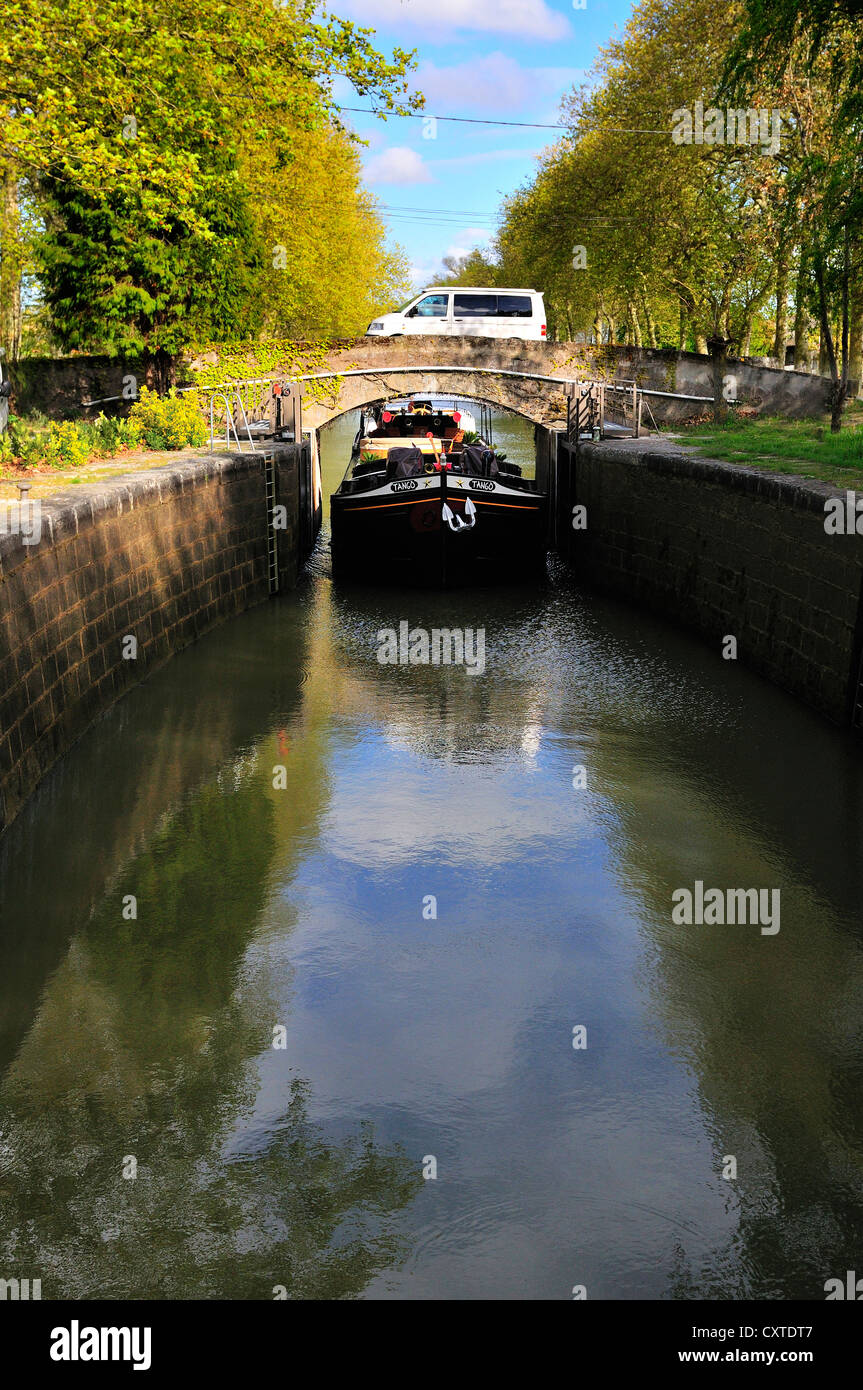 Scene of canal barge entering a lock,as it goes towards the summit of ...
