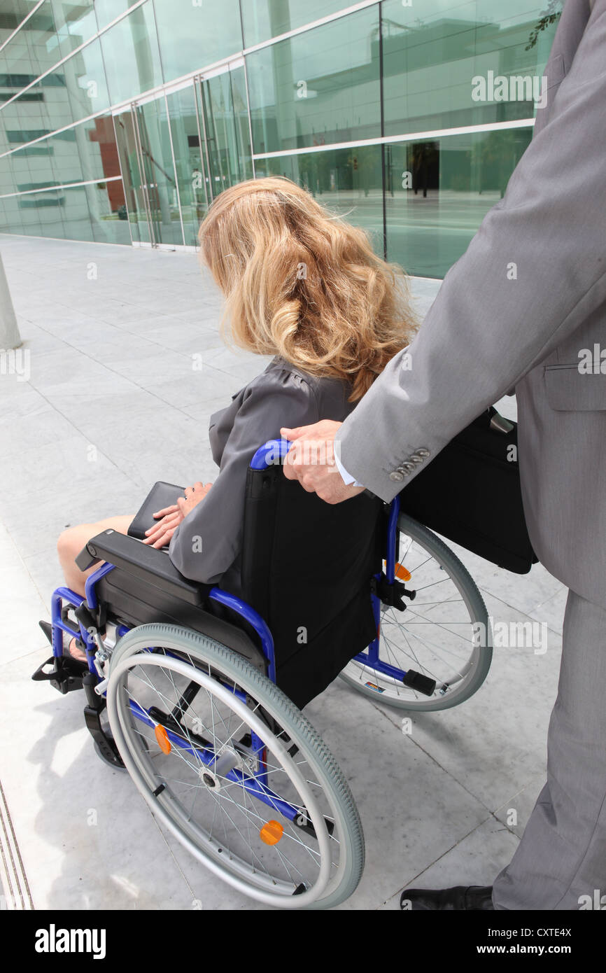 help handicapped woman on wheelchair Stock Photo - Alamy
