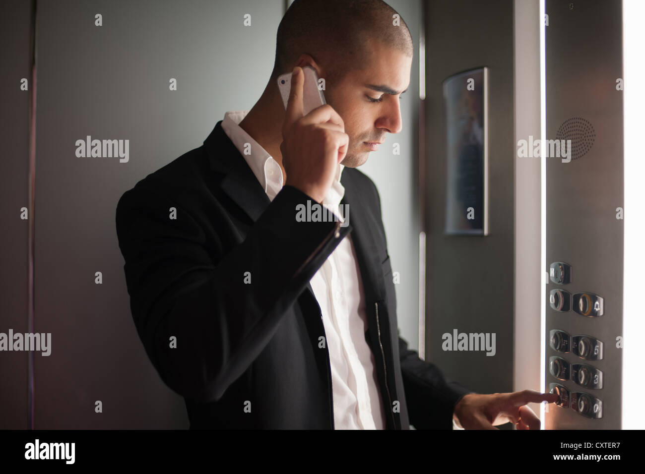 Inside elevator talking hi-res stock photography and images - Alamy