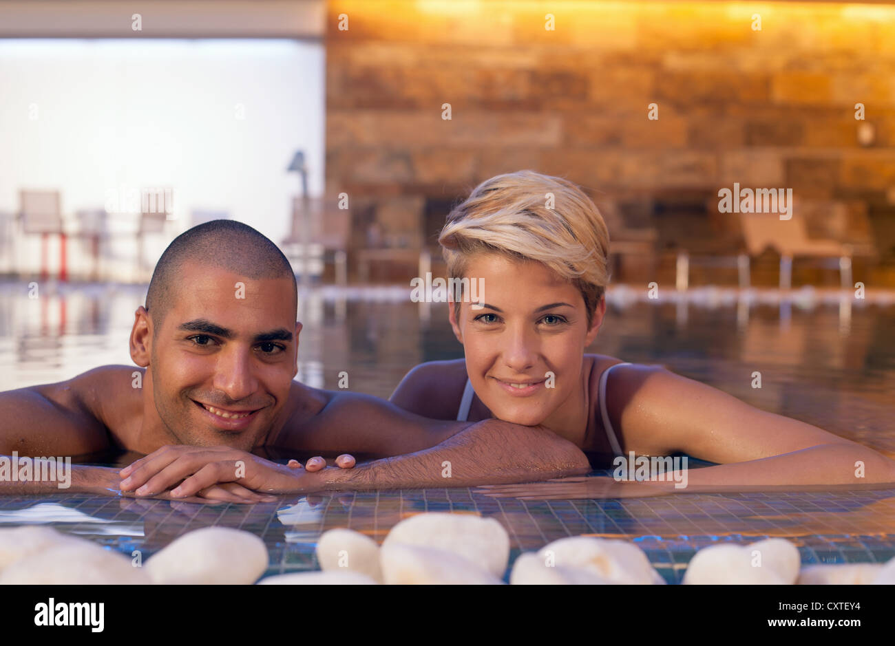 Woman leaning head on folded arms hi-res stock photography and images ...
