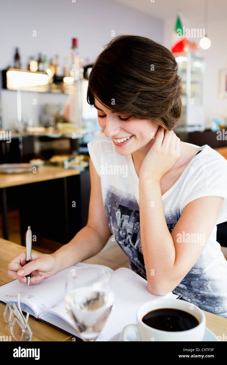 Woman writing pen diary colour hi-res stock photography and images - Alamy