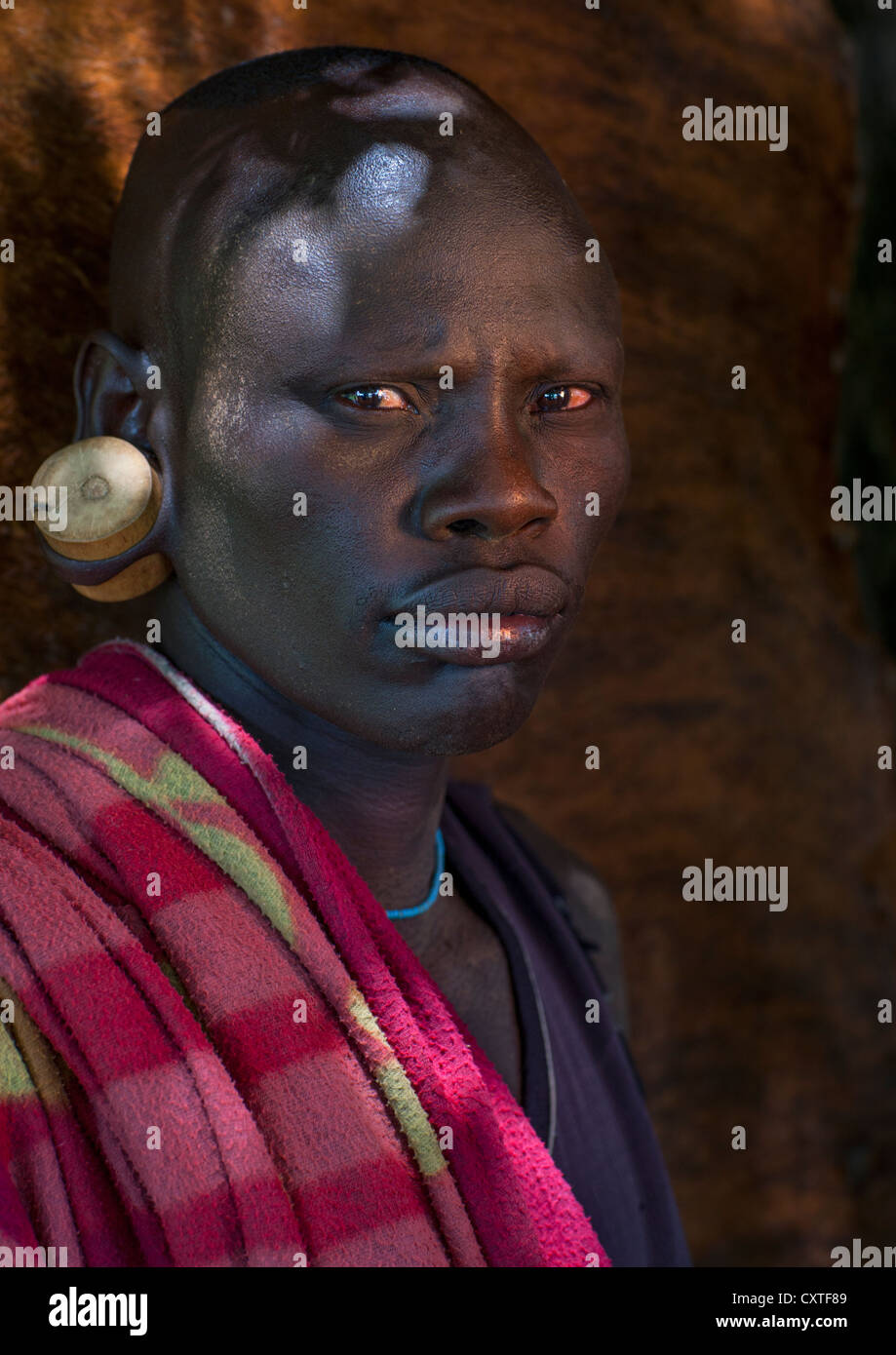 Mursi Tribe Man With Enlarged Earlobes And Wooden Earring, Chaidu, Omo ...