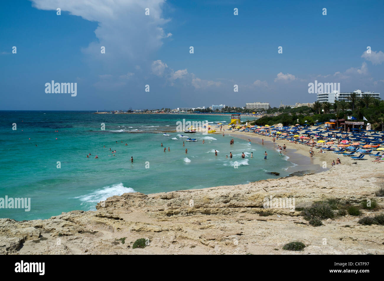 dh AYIA NAPA CYPRUS SOUTH Bathers sandy beach coast and holiday resort ...