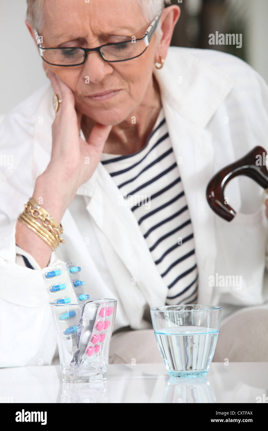 Lady with her medication Stock Photo - Alamy