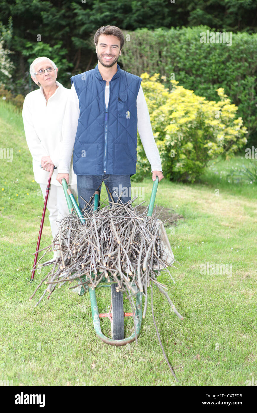 young man with wheelbarrow Stock Photo - Alamy