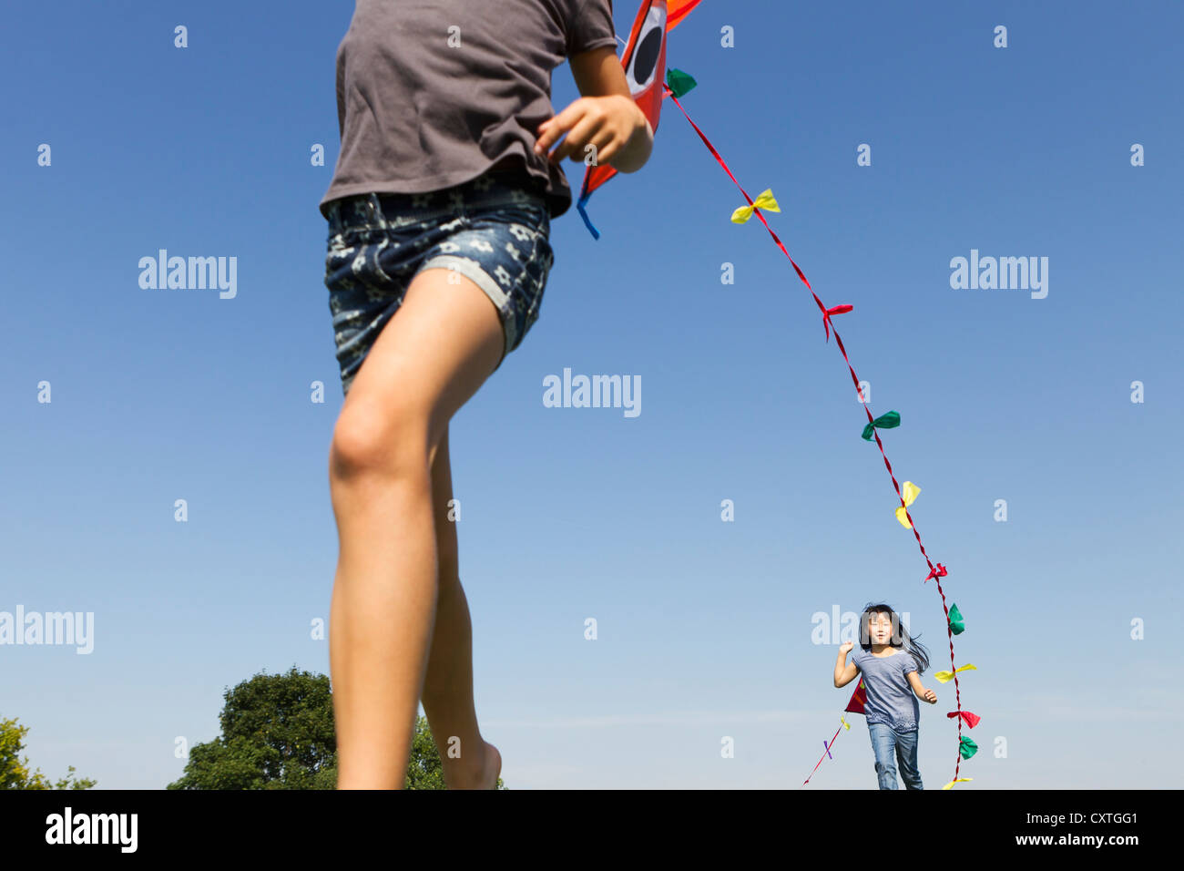 Children playing with kites outdoors Stock Photo - Alamy