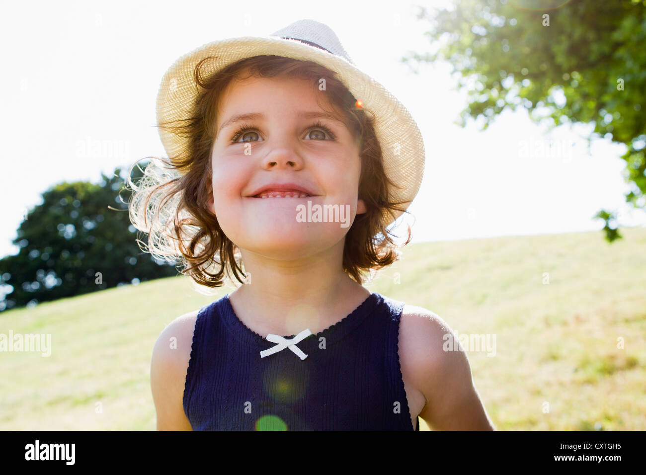 Smiling girl walking outdoors Stock Photo - Alamy