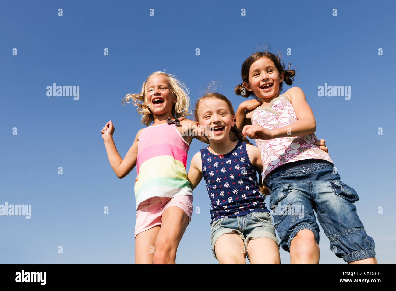 Girls playing together outdoors Stock Photo - Alamy