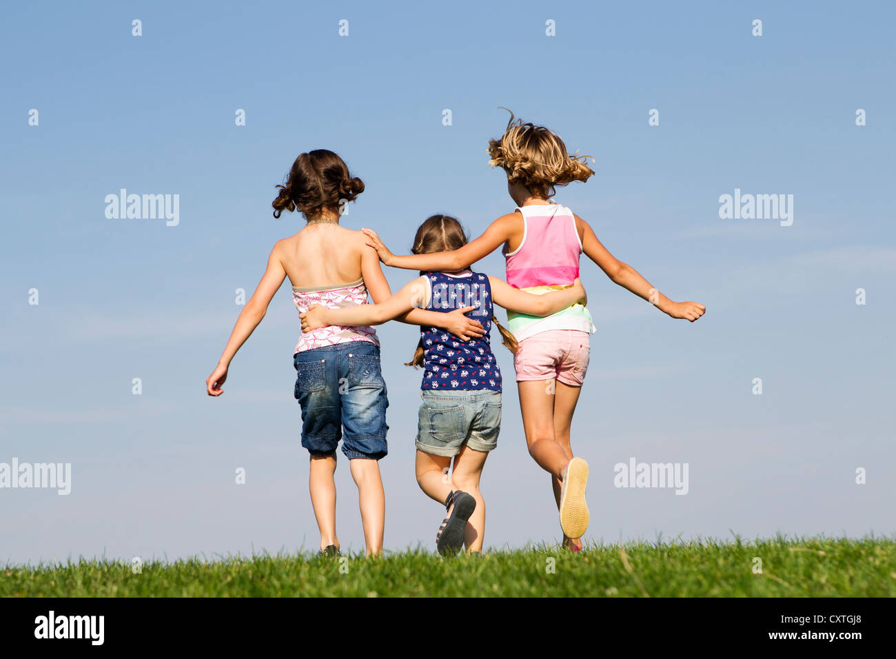 Girls playing together outdoors Stock Photo - Alamy