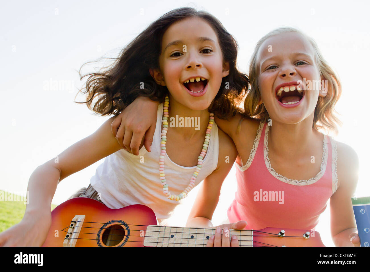 Girls singing together outdoors Stock Photo - Alamy