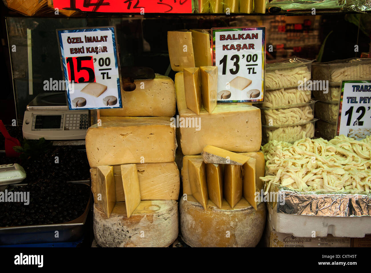 different kinds of cheese sold in a store at the food market near the ...