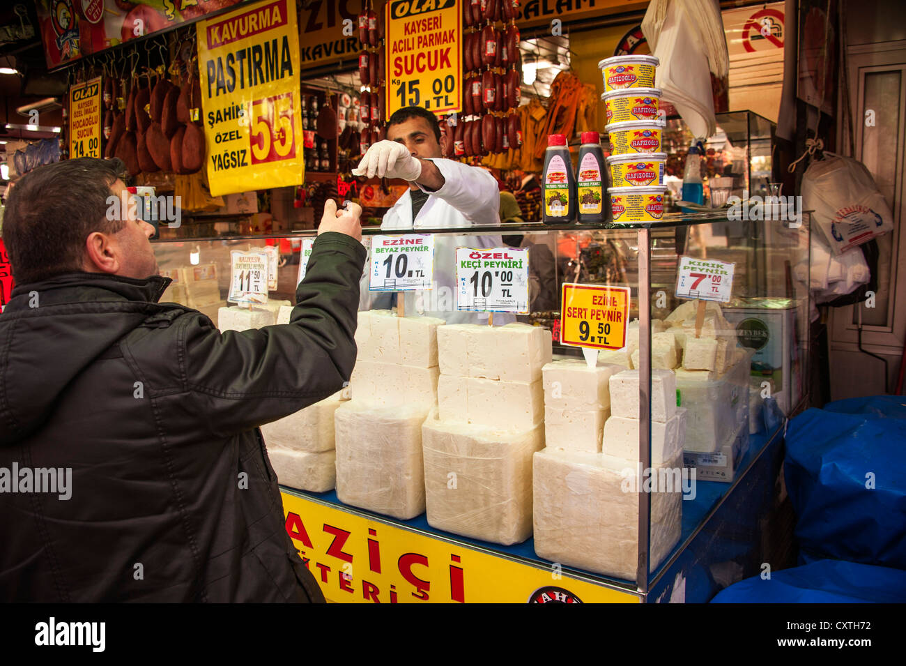 different kinds of cheese sold in a store at the food market near the ...