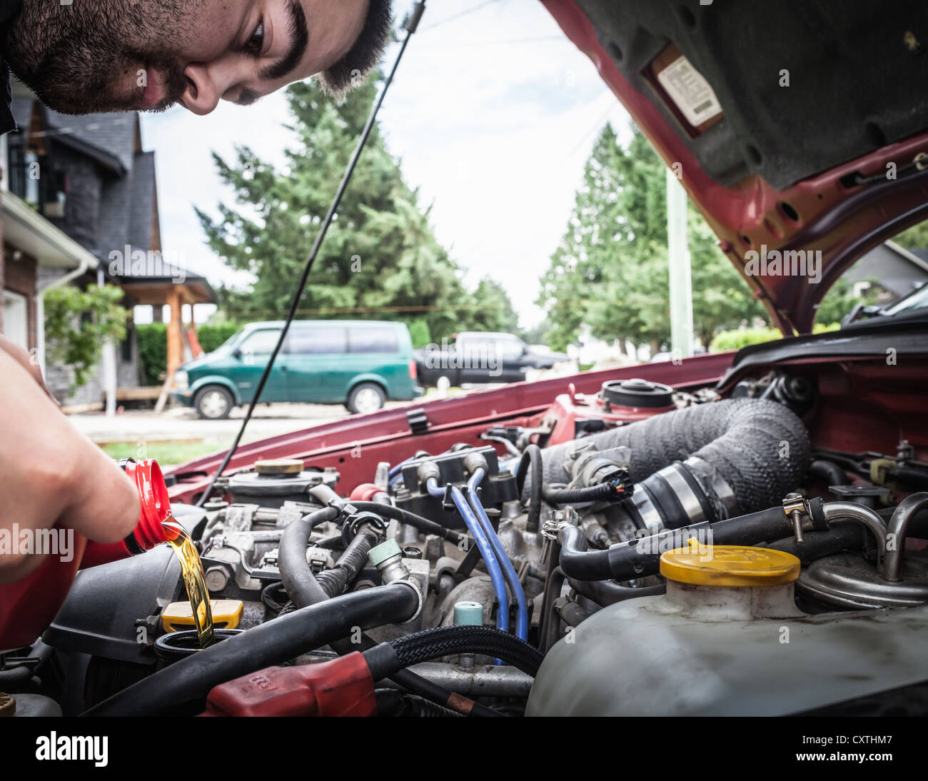 Man working on car engine Stock Photo - Alamy