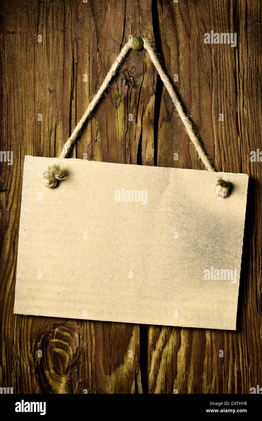 the paper board hanging on wooden wall Stock Photo - Alamy
