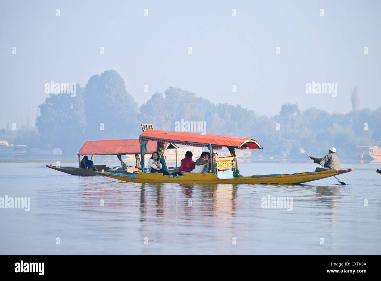 Tourists on Shikaras enjoy the peaceful morning of Nagin Lake Stock ...