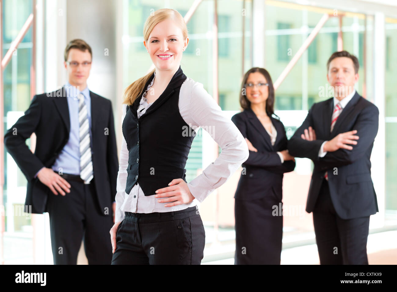 Business - group of businesspeople posing for group photo in office ...