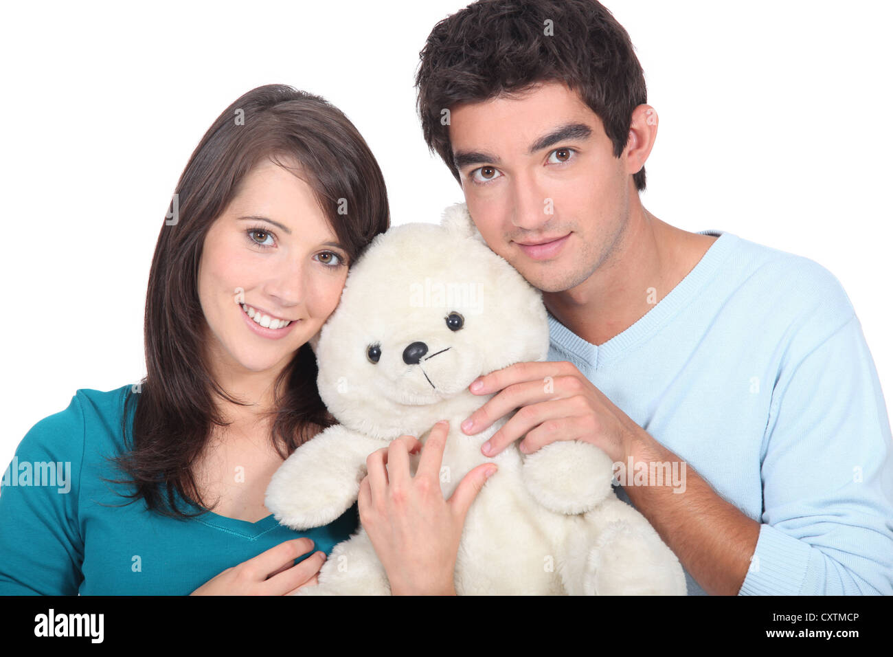 Young couple holding stuffed toy Stock Photo - Alamy