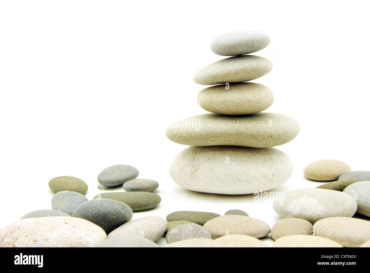 Stack of balanced stones on a white background Stock Photo - Alamy