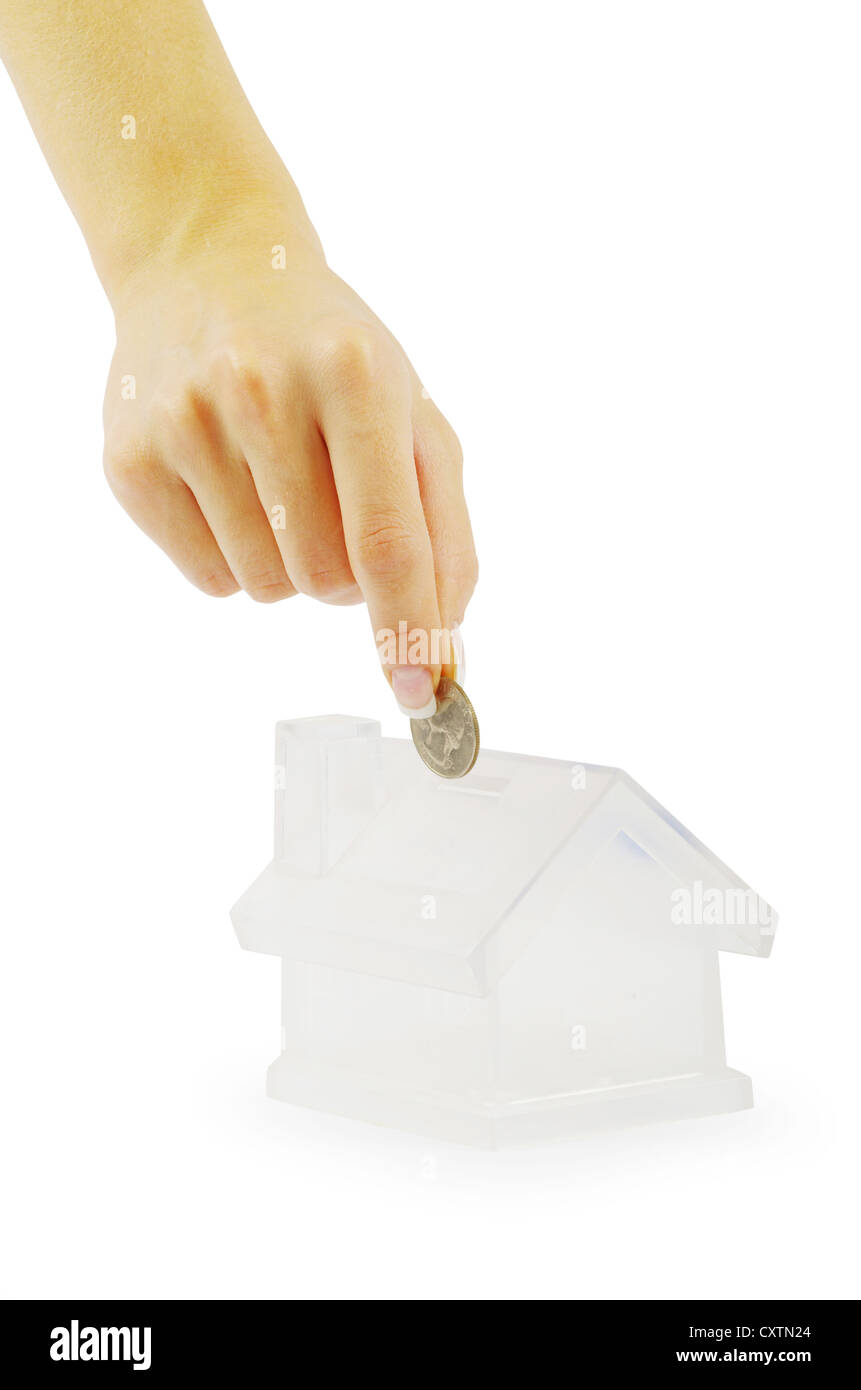 Hand with coin and house bank isolated on white background Stock Photo ...