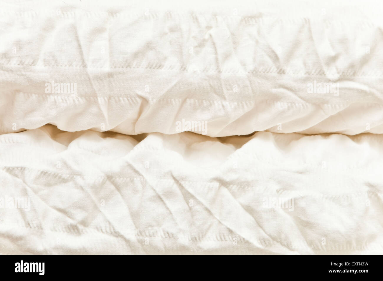 Close up of a folded cotton duvet cover as a background Stock Photo - Alamy