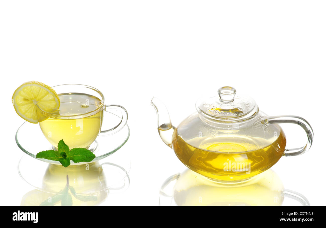 Tea being poured into glass tea cup Stock Photo - Alamy