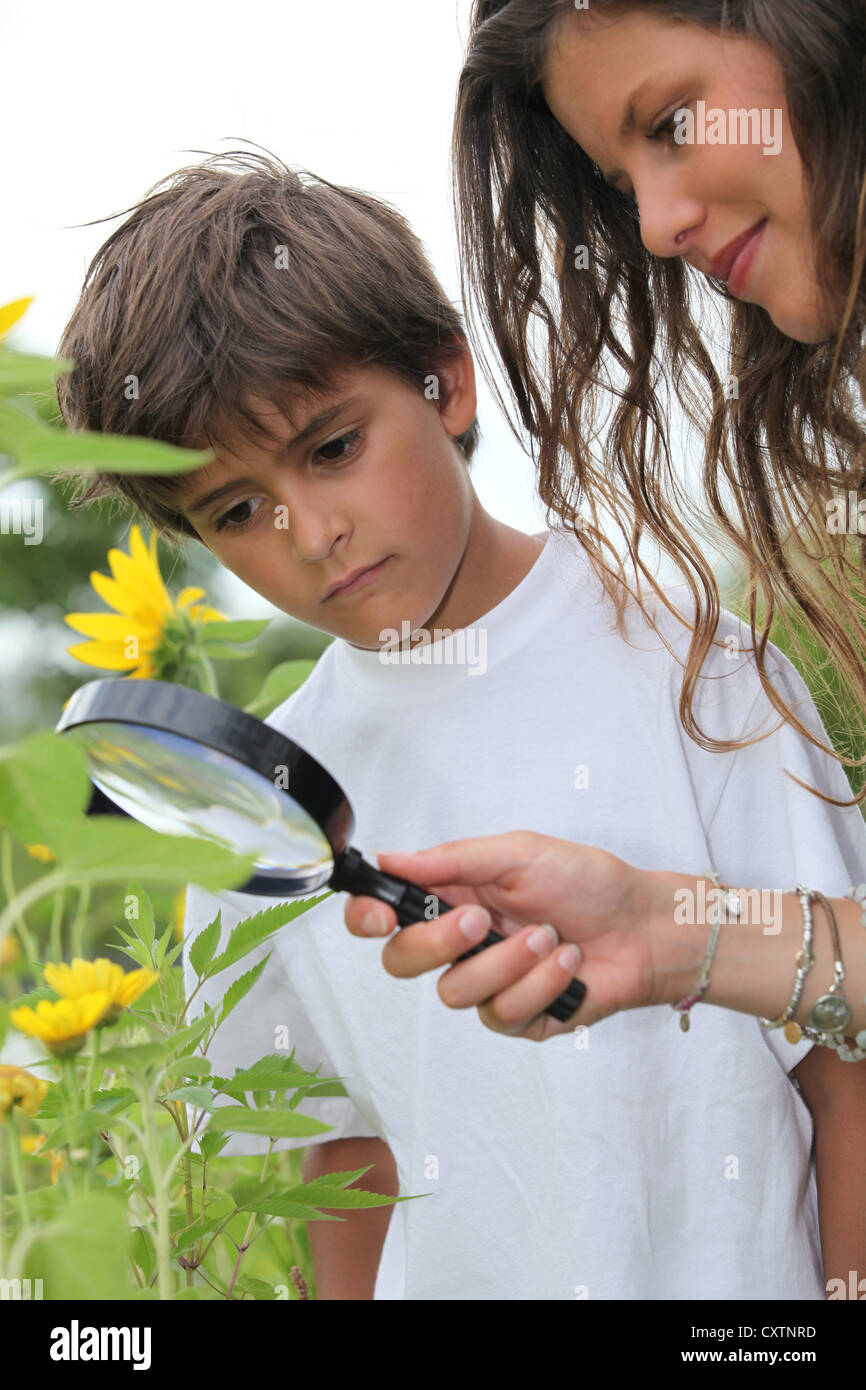 boy and mother observing nature Stock Photo - Alamy