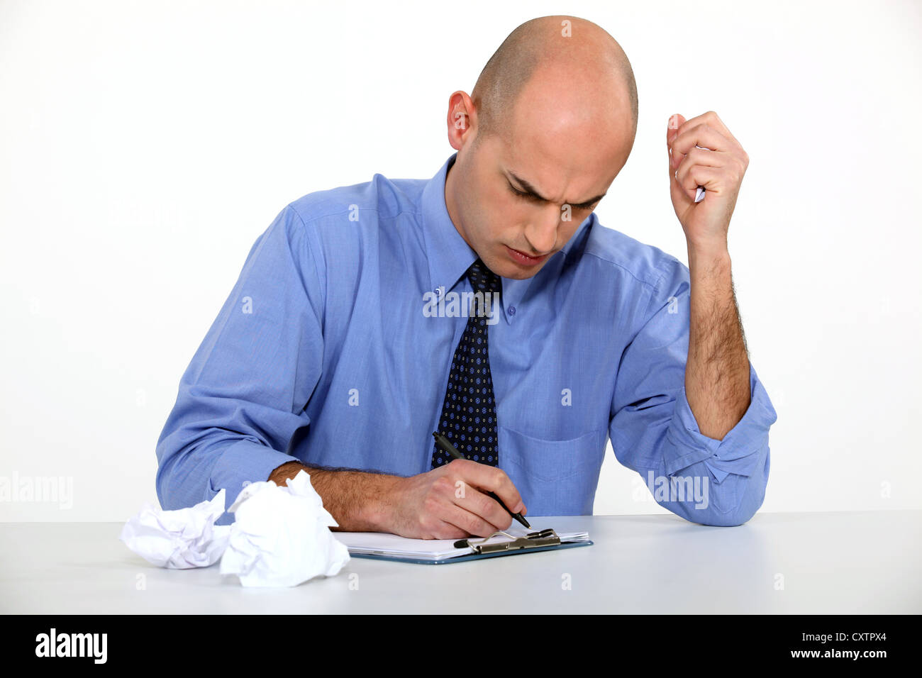 creative businessman writing at his desk Stock Photo - Alamy