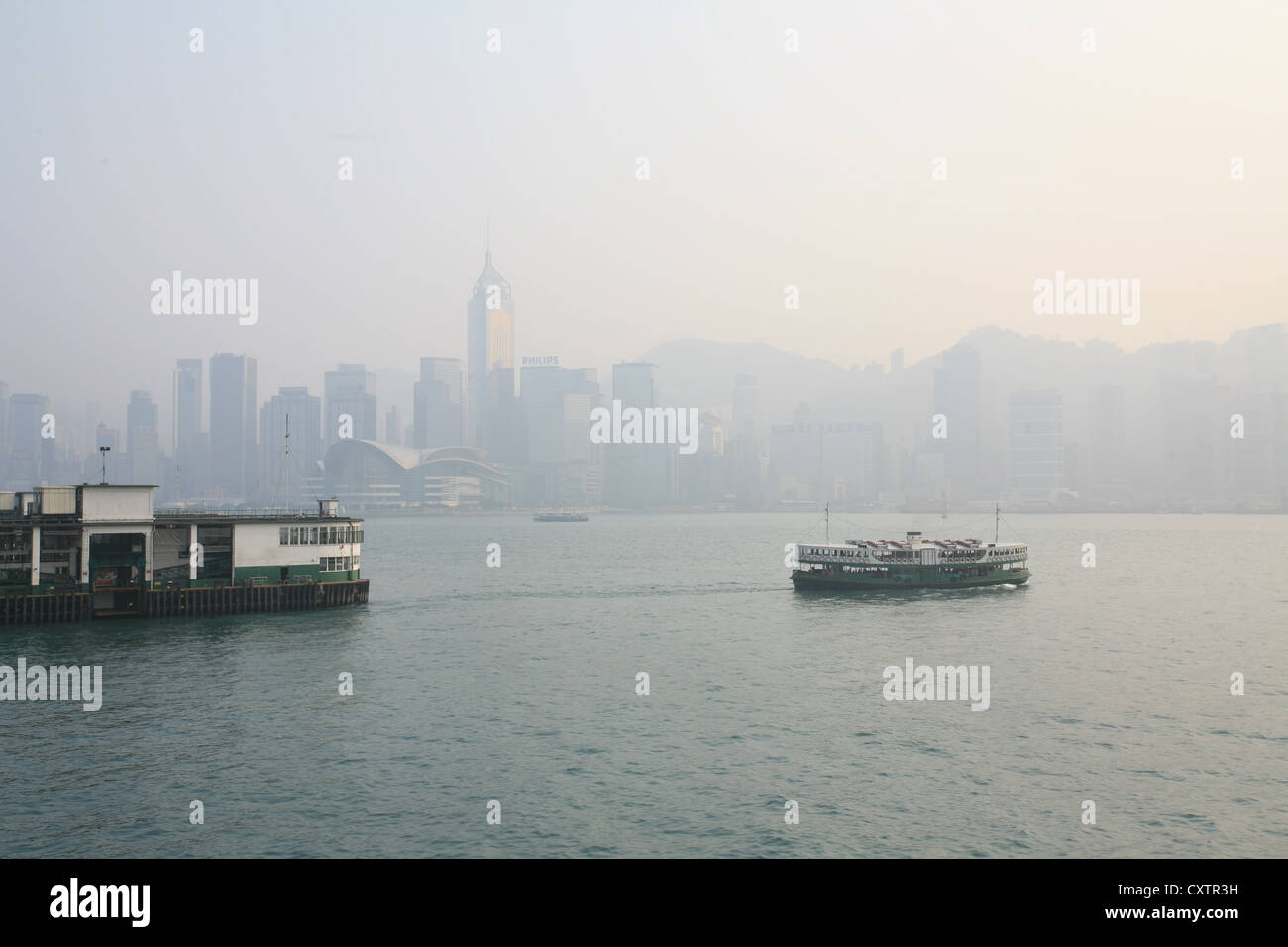 ship in Hong Kong Victoria bay with tall skyscraper Stock Photo - Alamy