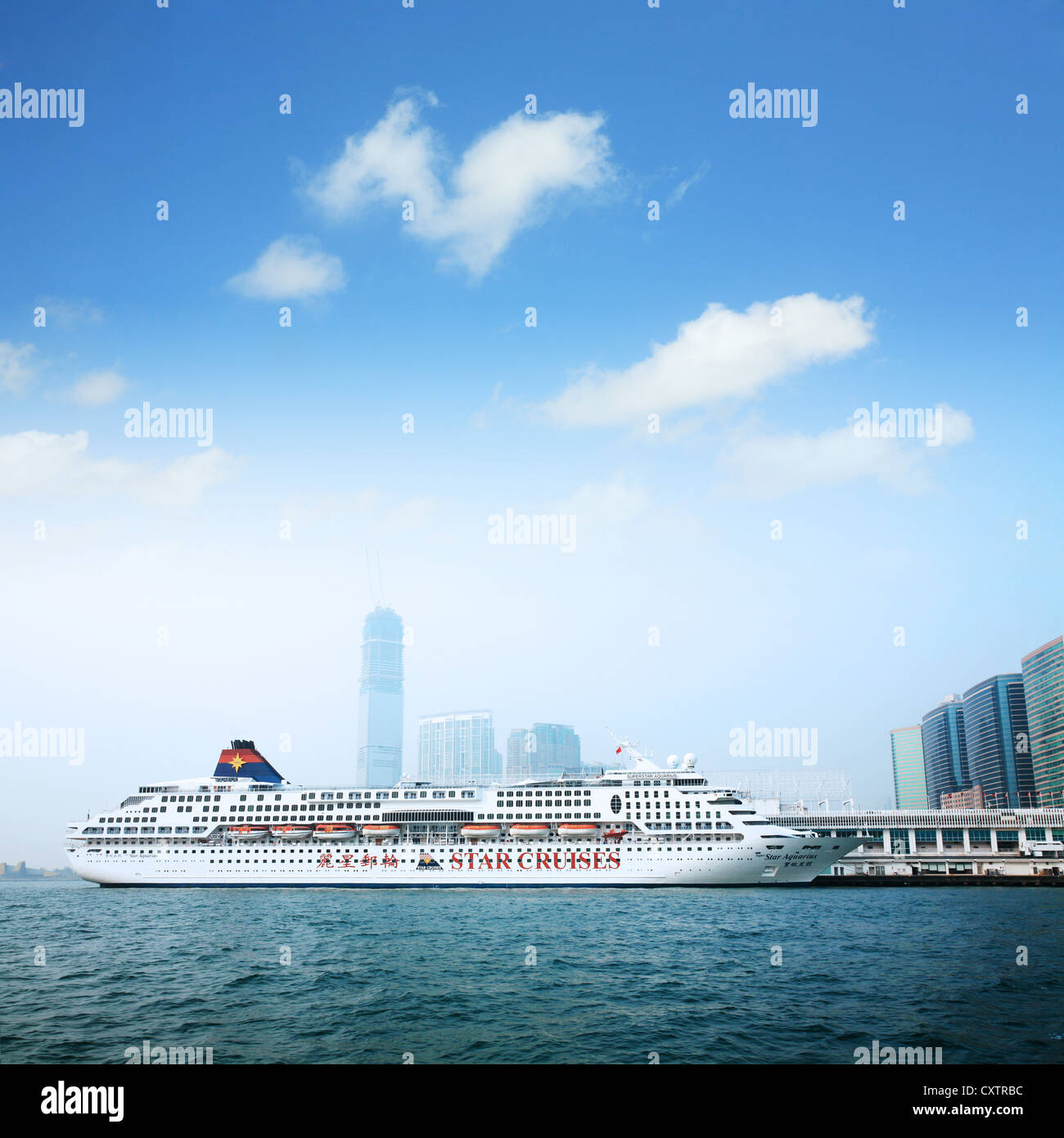 ship in Hong Kong Victoria bay with tall skyscraper Stock Photo - Alamy