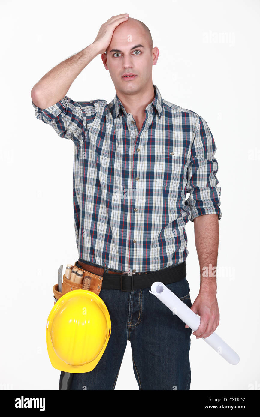Shocked bold builder Stock Photo - Alamy