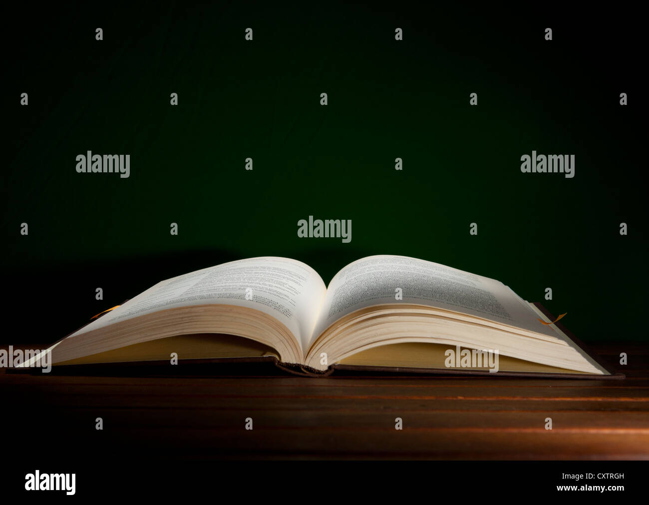 Open book in the shadows Stock Photo - Alamy