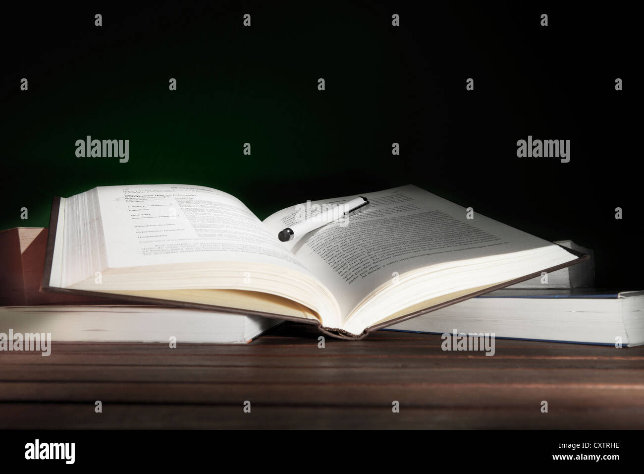 Open book in the shadows Stock Photo - Alamy