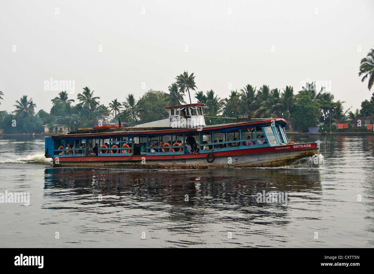 Horizontal view of a traditional river ferry or taxi full with ...