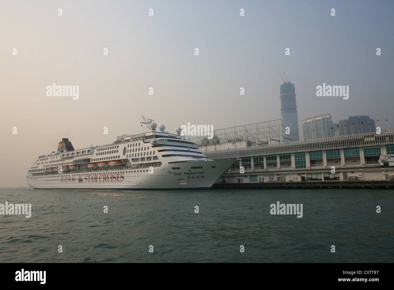 ship in Hong Kong Victoria bay with tall skyscraper Stock Photo - Alamy