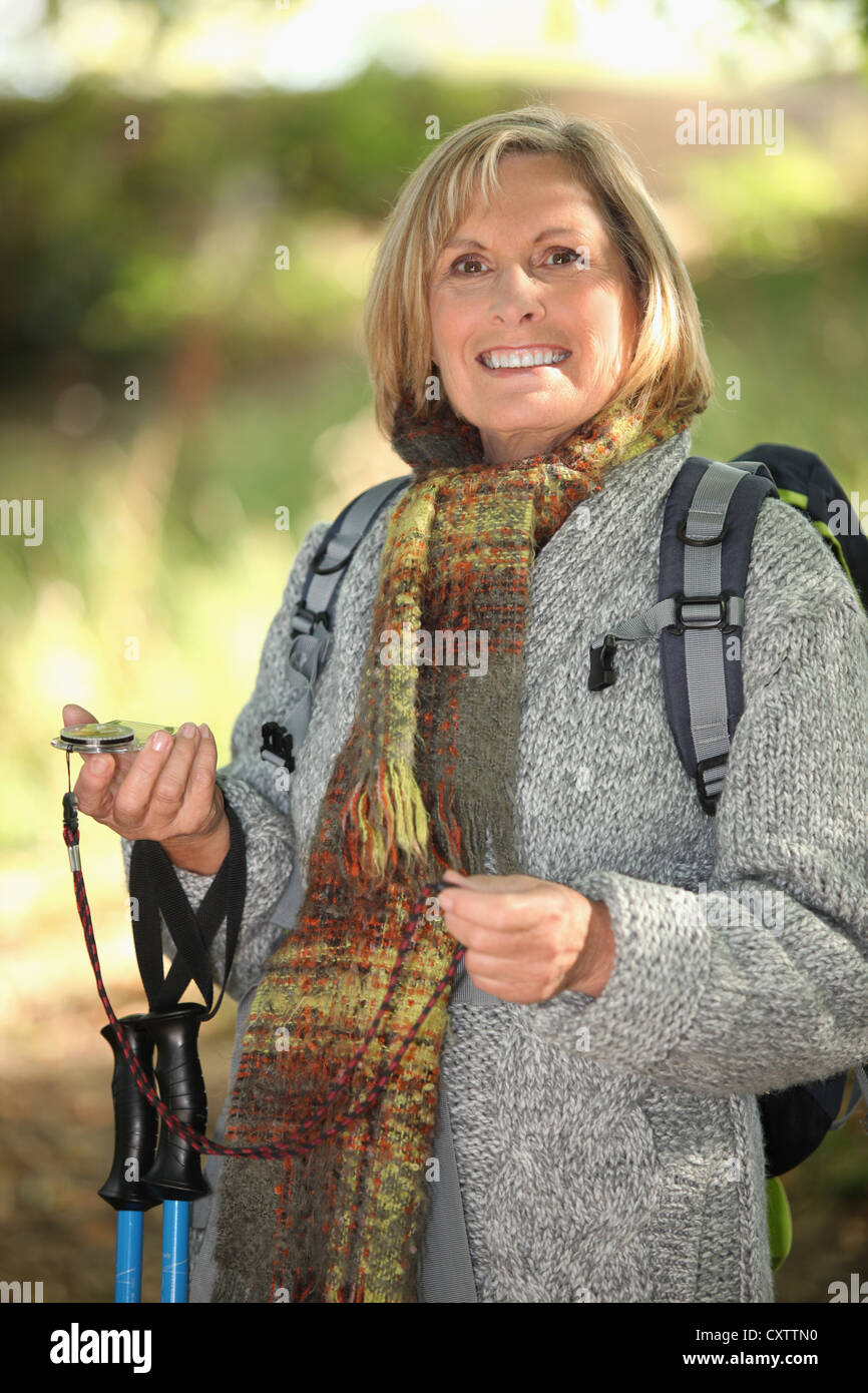 Woman with compass Stock Photo - Alamy
