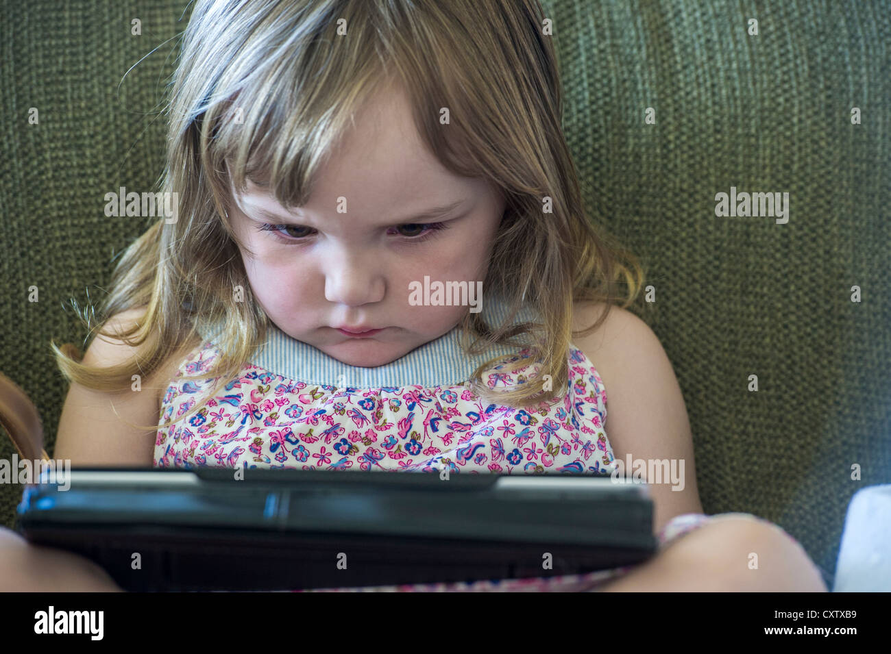 Child with computer tablet Stock Photo - Alamy